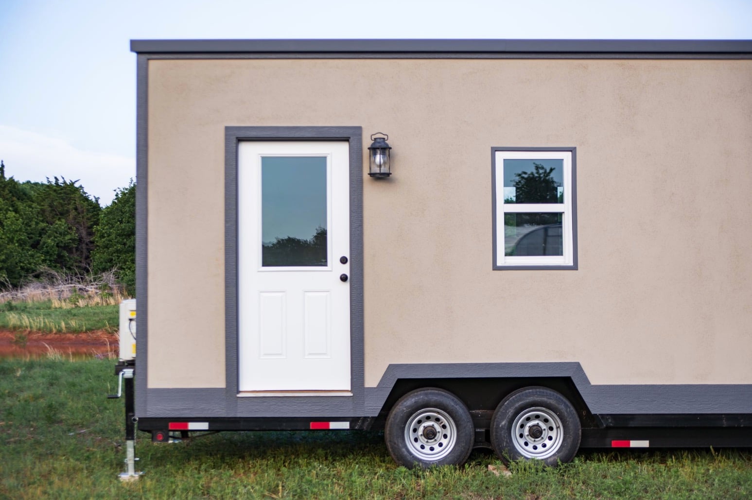 24ft SIP Tiny House on Wheels with Faux Stucco Paint by Cornerstone ...