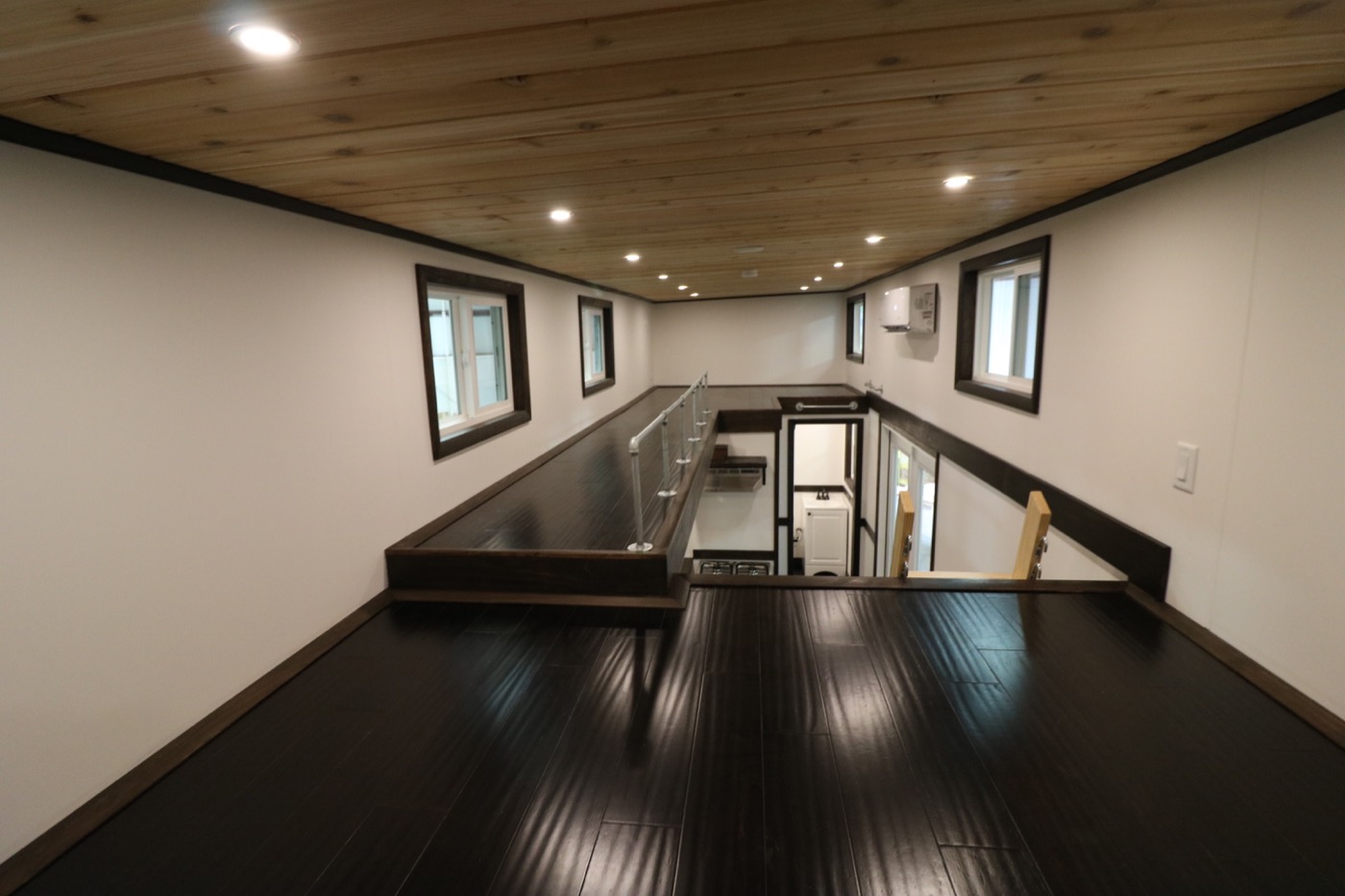 Family of Three’s Off-Grid Tiny House with 12ft Loft-to-Loft Catwalk