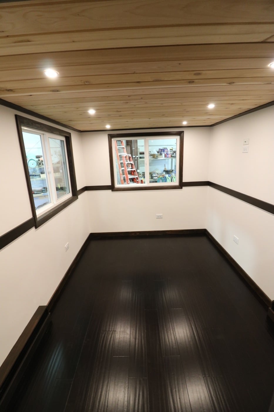 Family of Three’s Off-Grid Tiny House with 12ft Loft-to-Loft Catwalk