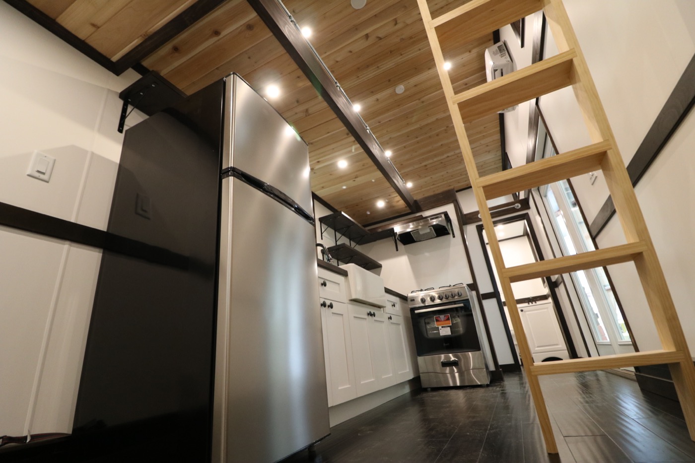 Family of Three’s Off-Grid Tiny House with 12ft Loft-to-Loft Catwalk