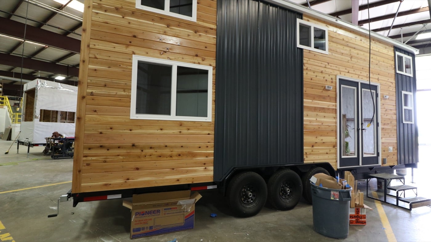 Family of Three’s Off-Grid Tiny House with 12ft Loft-to-Loft Catwalk