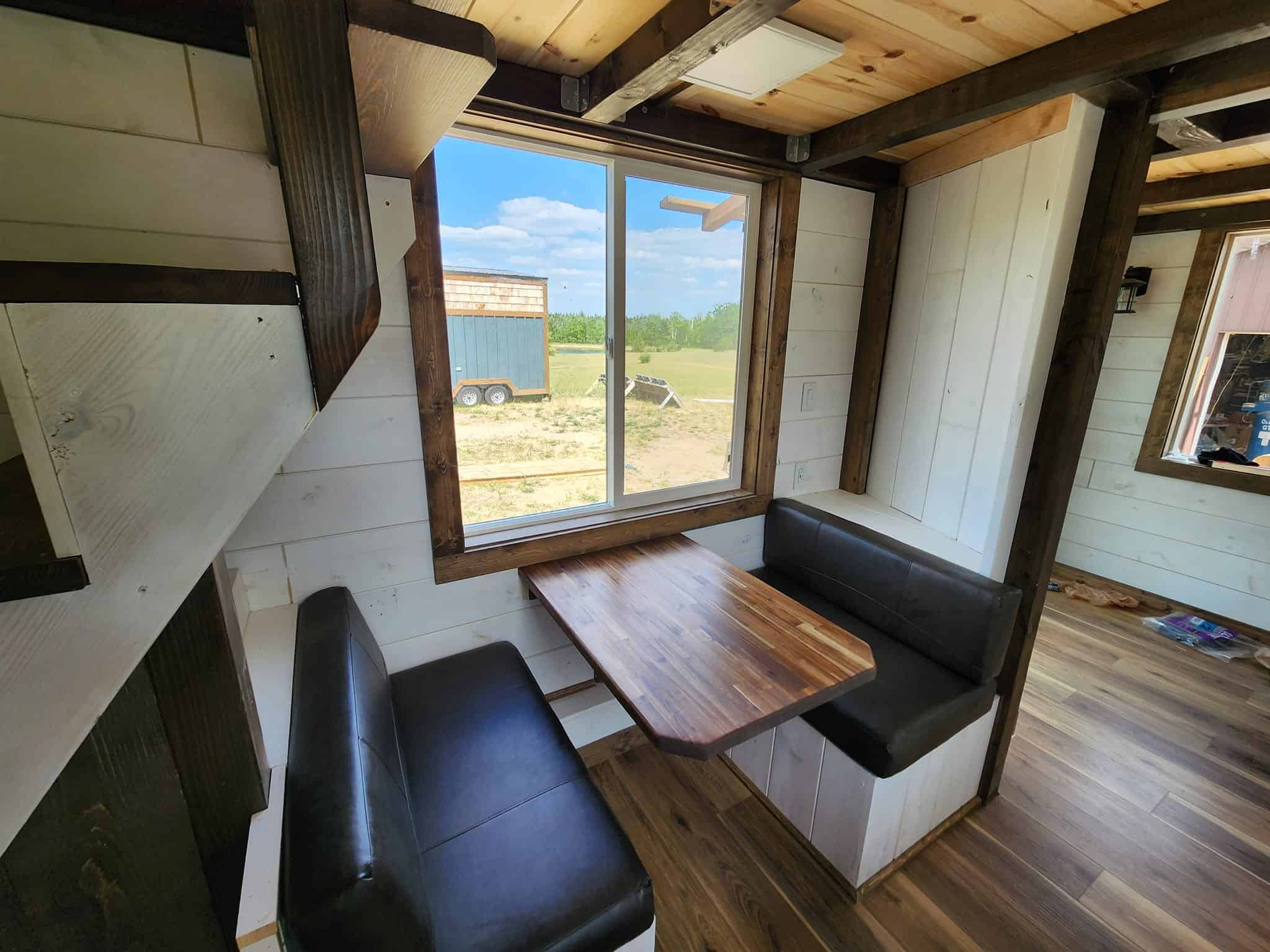 Timber Craftsman Tiny House with a First Floor Bedroom and Two Lofts