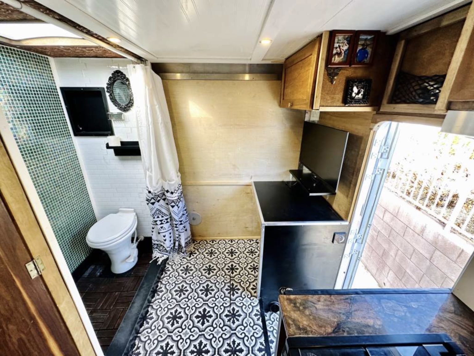 Stealth Box Truck Tiny House with Unique Rear Deck