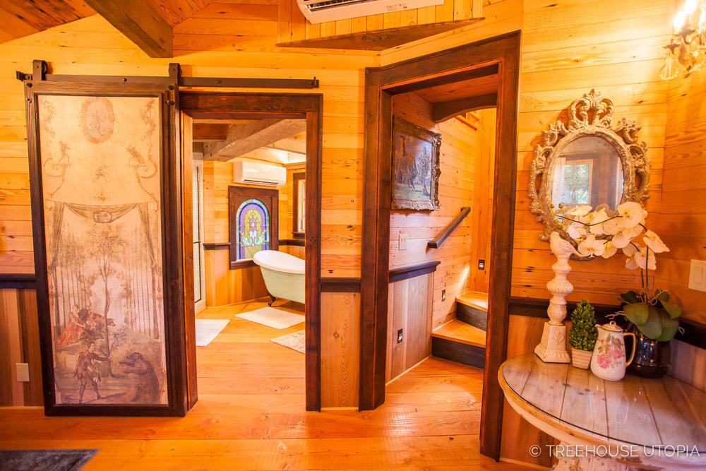 Chateau Treehouse Suspended in Three Towering Cypress Trees