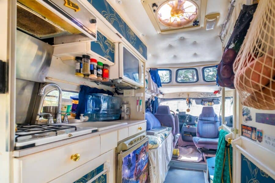 Couple & Cat In This 1999 Dodge Roadtrek Camper Van