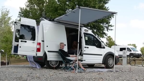 Cynthia & Her Dog in Their Ford Transit Connect Conversion