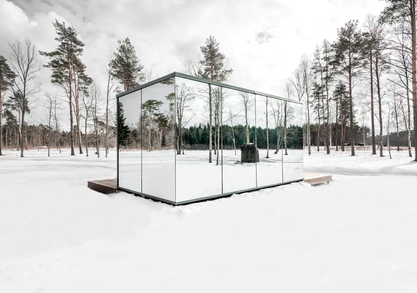 Lakeside Tiny House in Estonia with Over-sized Reflective Windows