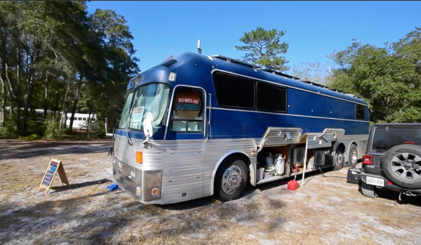 Family Ditches Rat Race for Coach Bus Living