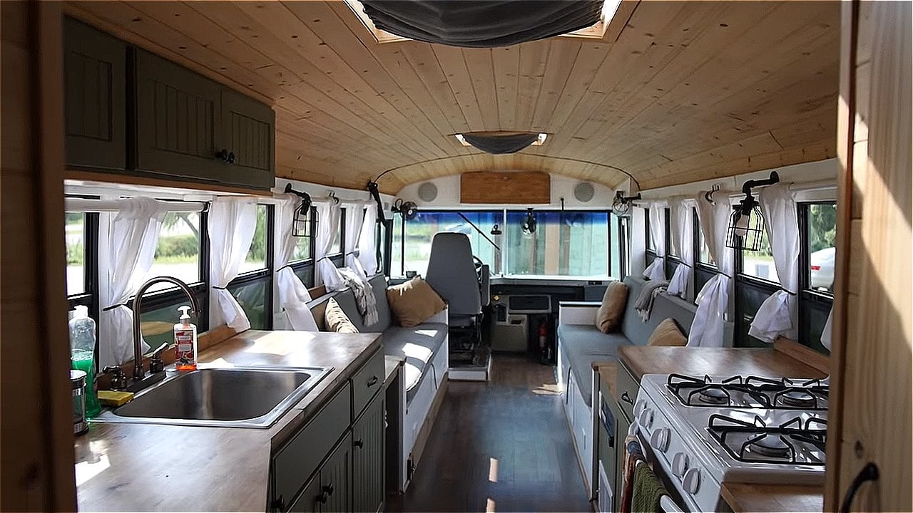 School Bus Conversion With a Rooftop Deck That Sleeps Six!