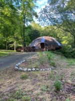 This Round, Rustic Cabin is Shaped like a UFO!