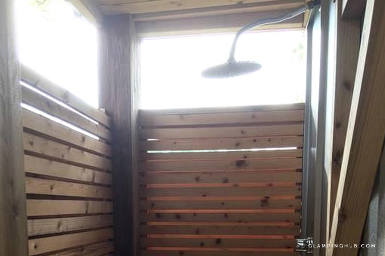 Quirky industrial-style tiny house with built-in outhouse w/ outdoor ...