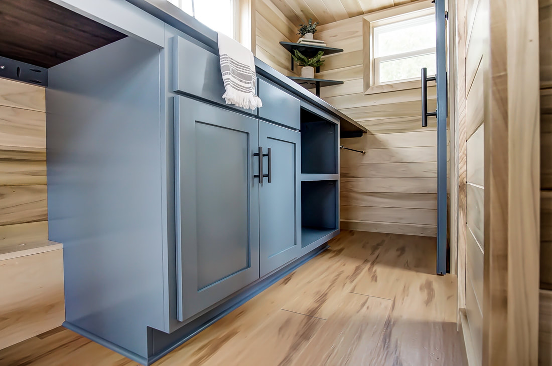 The Baby Blue Hatteras Tiny House by Modern Tiny Living