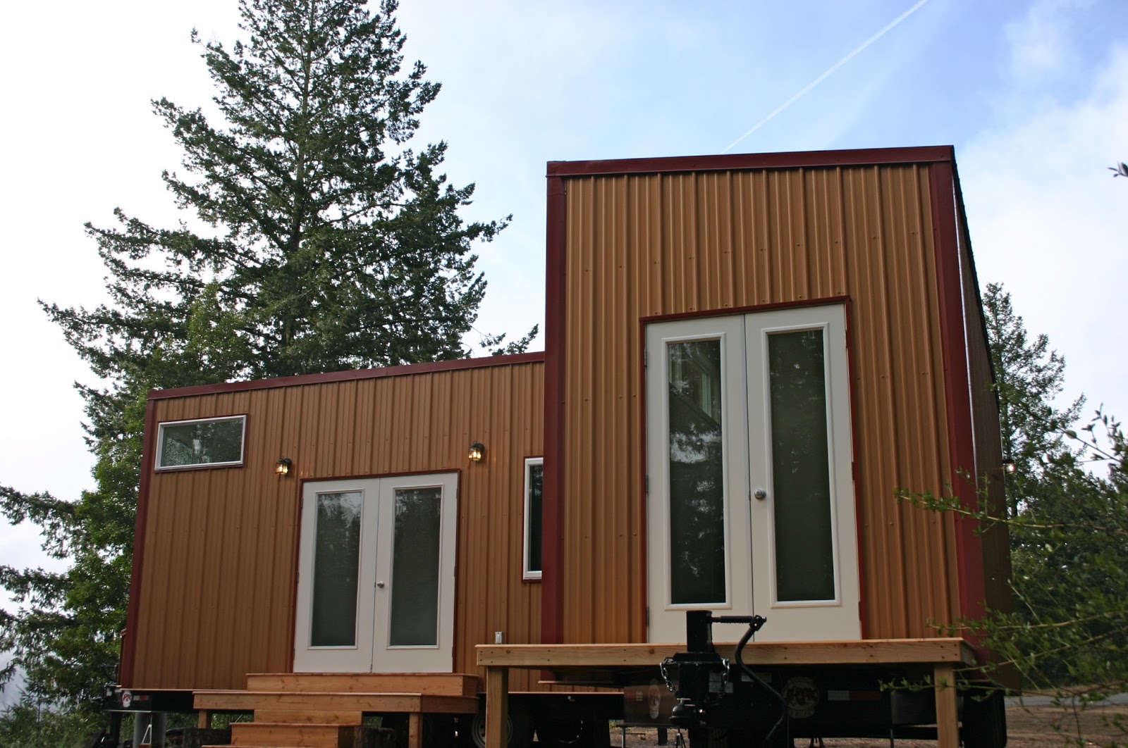 Two Tiny Houses on Wheels Joined Together
