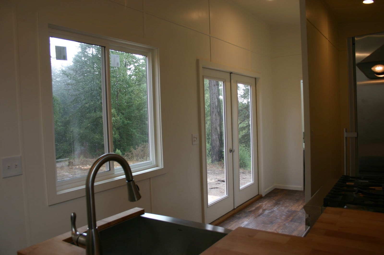 Two Tiny Houses on Wheels Joined Together