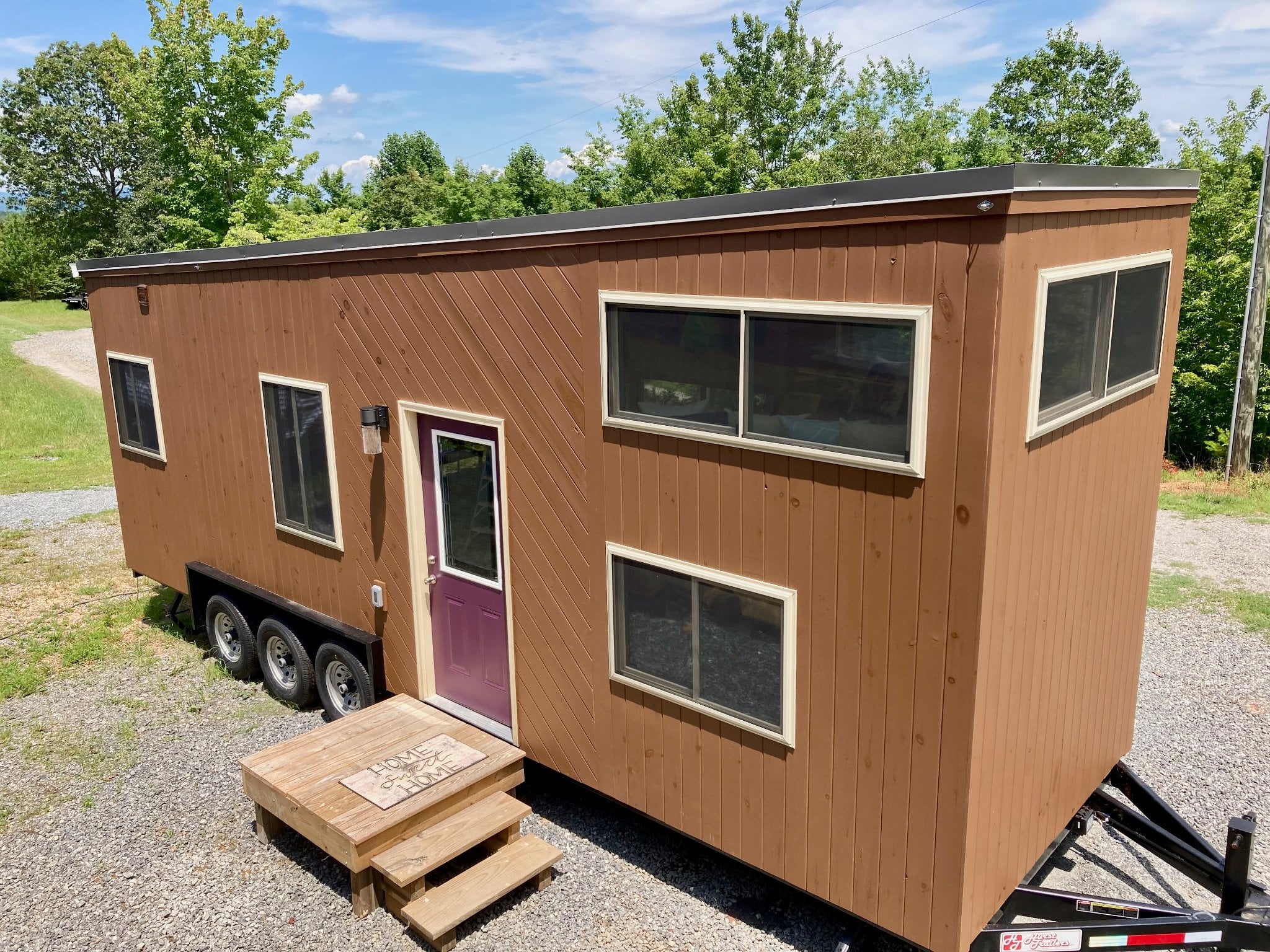 This Tiny House has a Ground Floor Bedroom and a Living Room Loft