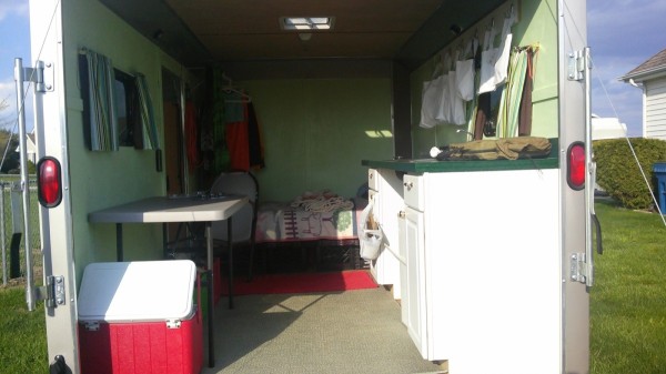 Woman Converts Cargo Trailer into Stealthy and Cozy Off-Grid RV