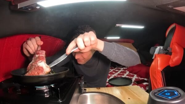 Life in his Self-Converted Chevy Camaro Camper